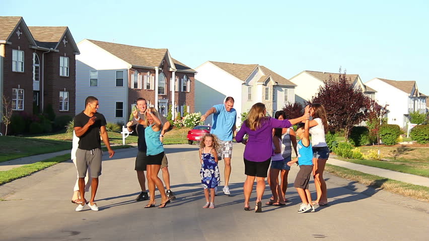 A Happy Group Of Neighborhood Residents Dance In The Street Stock ...