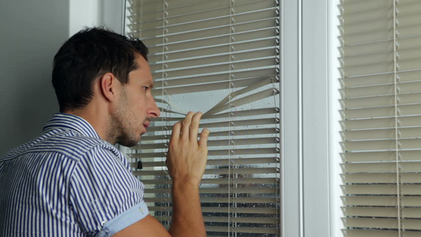 Handsome Man Looking Through The Window At Home Stock Footage Video 7021054 - Shutterstock