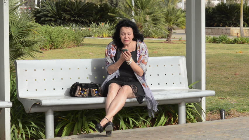 Mature Black Haired Woman Has A Big Disagreement During Cellphone