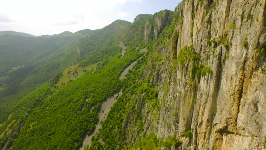 Mountain Cliffs Rock Formations Aerial Camera Fly Between Vertical ...