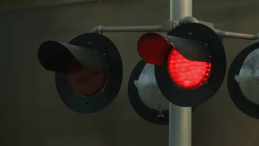 Flashing Red Warning Lights Operating At A Railway Level Crossing To ...