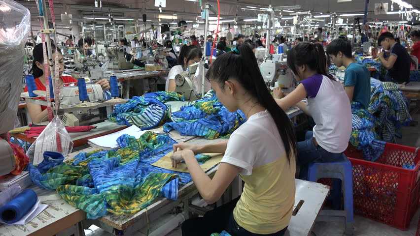 HO CHI MINH CITY, VIETNAM - 9 DECEMBER 2015: Workers Perform Manual ...