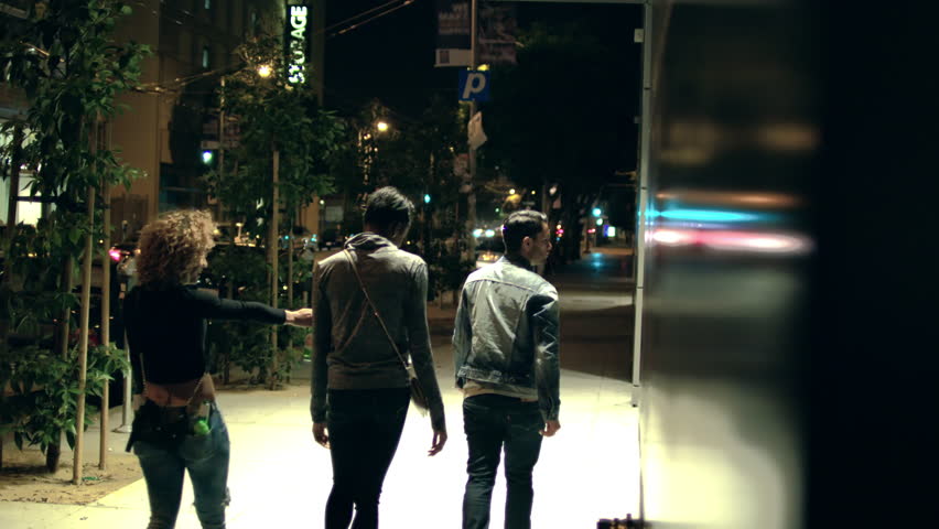 Group Of People Walking At Night On Street, Steadycam Shot Stock ...