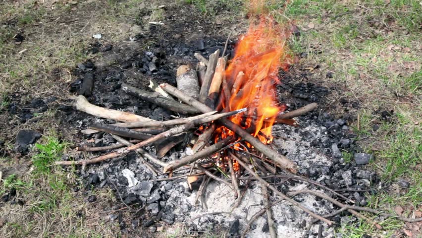 A Small Bonfire Burning Outside In The Woods On A Winter Day Stock ...
