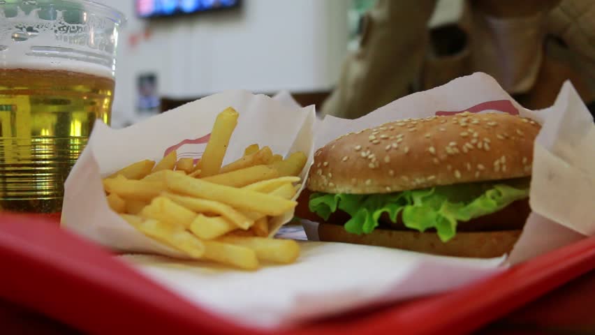 Fried Potato Chips Falling Down On Hamburger, Slow Motion, Fast Food ...