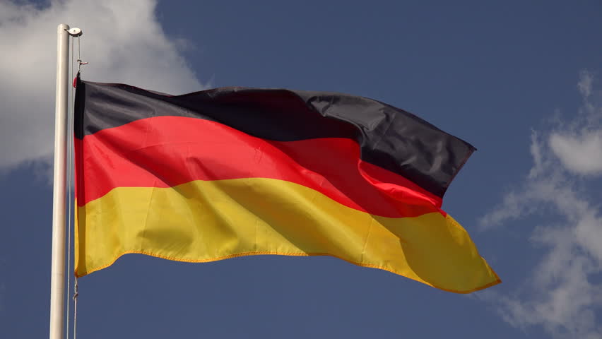 Flag Of Germany On The Background Of The Sky And Flying Clouds. Shot In ...
