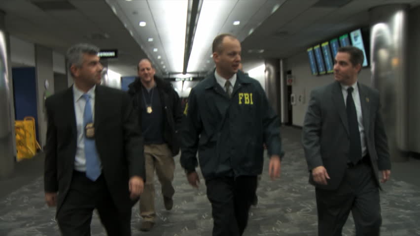 CIRCA 2010s - FBI Agents And Homeland Security Walk Through An Airport ...
