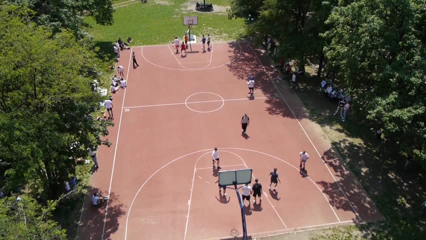 Aerial View On Group Of People Playing Basketball Outside On The ...