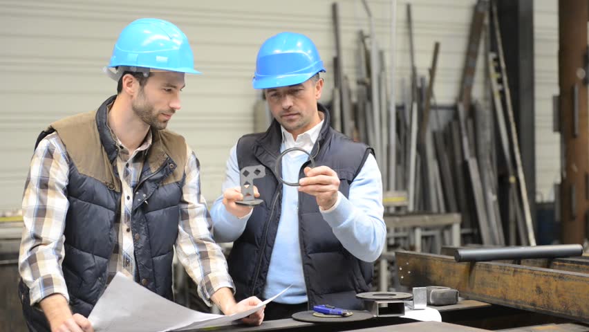 Engineer With Mechanical Worker Checking On Production Stock Footage ...