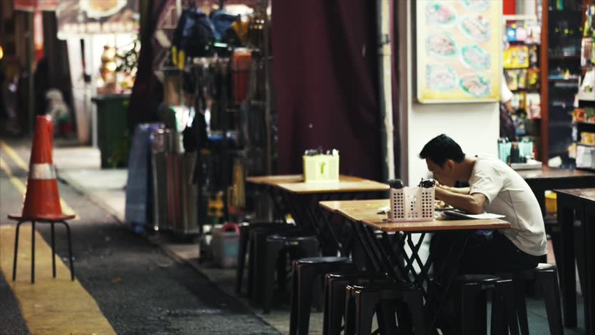 Singapore - March 2015 Man Eating Alone Along Street At Night Stock ...