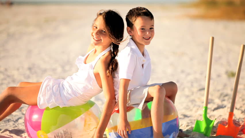 Happy Healthy Children Having Fun Playing On Beach Balls Stock Footage ...